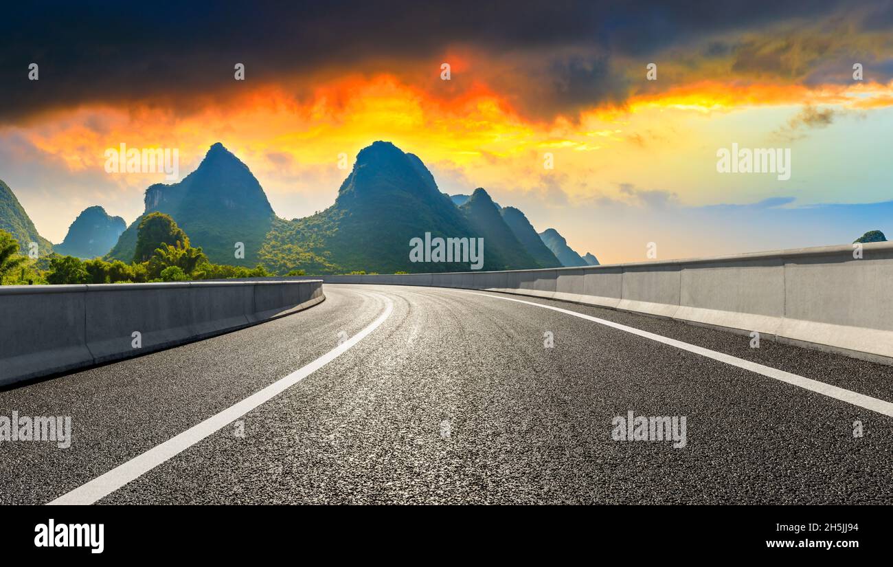 Country asphalt road and green mountain natural scenery in Guilin at ...
