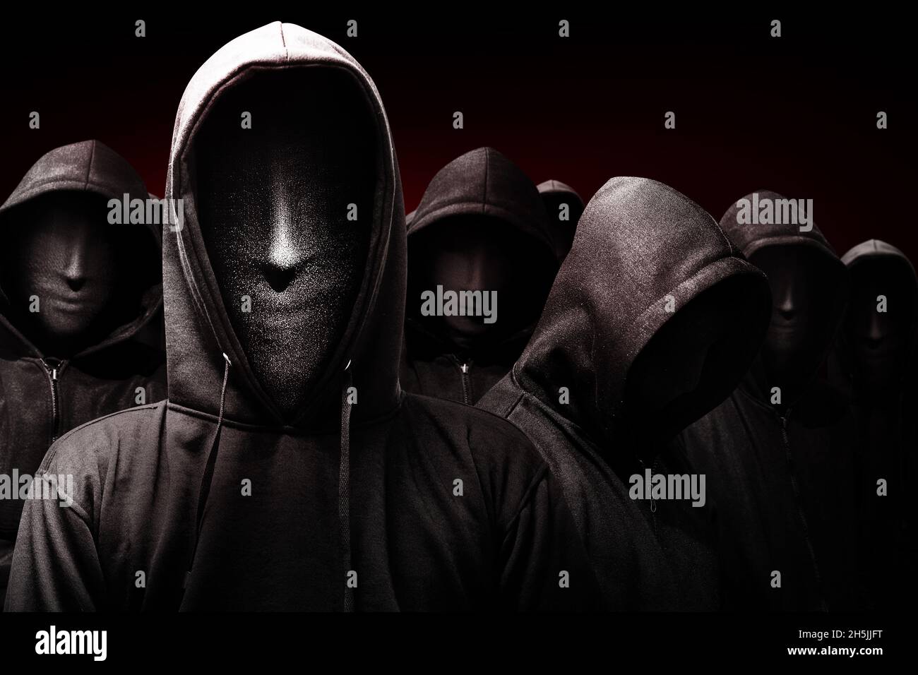 Group of criminal man in a hidden mask on black background Stock Photo ...