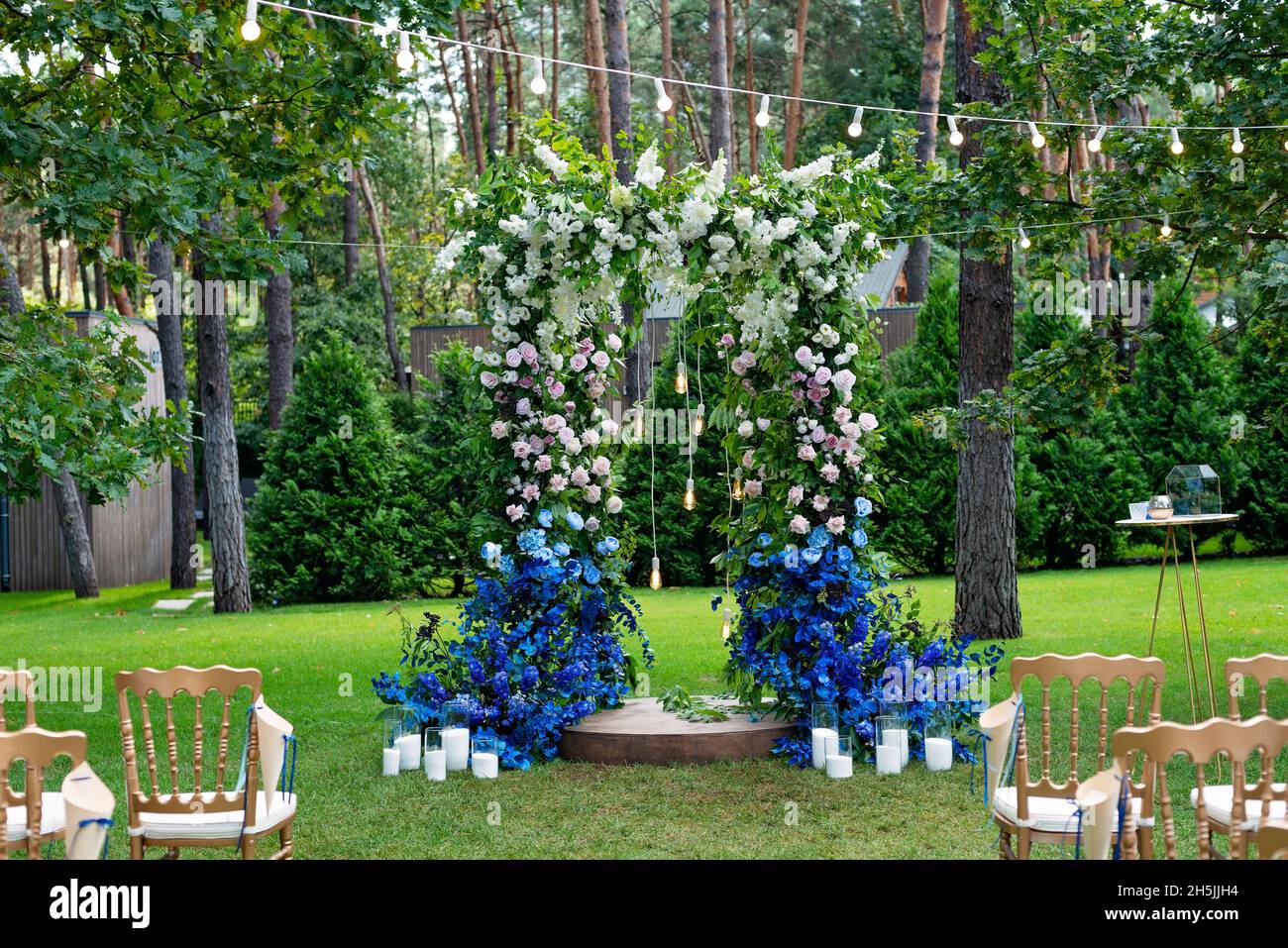 Outdoor wedding ceremony on a green lawn. Arch for a wedding ceremony ...