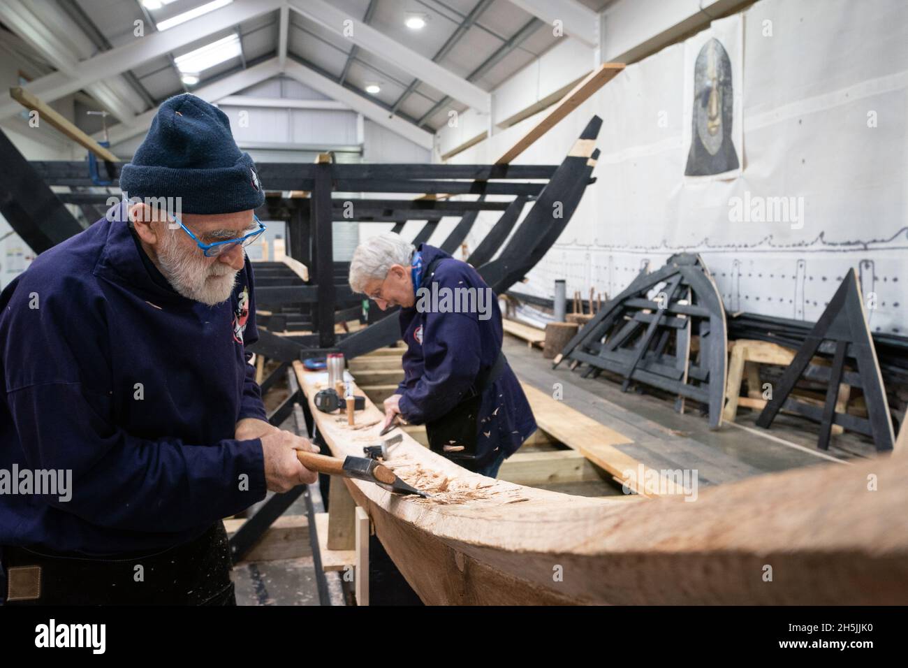 Bryan Knibbs (left) and David Turner work on the keel of the 88ft-long ...