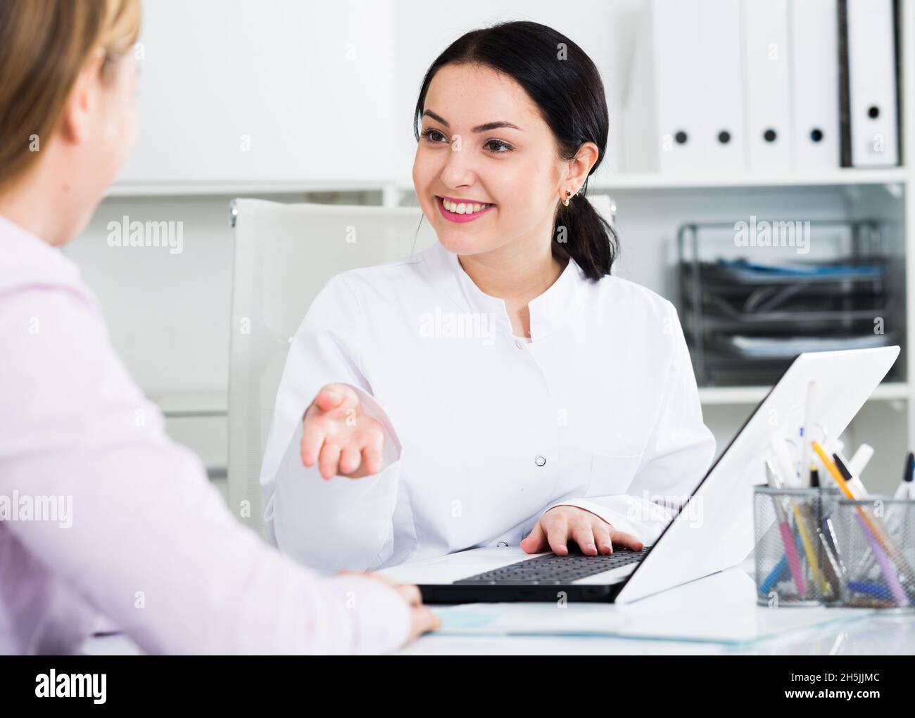 Nurse making appointment for client Stock Photo - Alamy