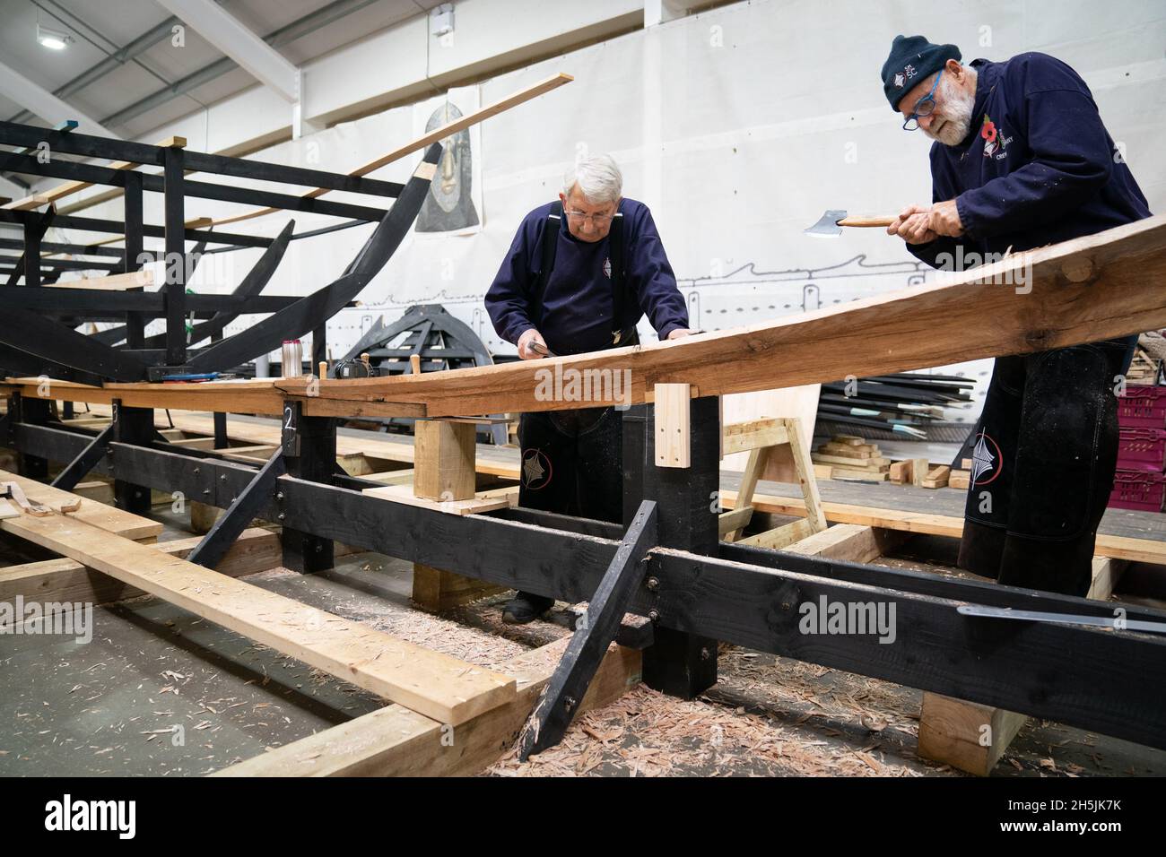 David Turner and Bryan Knibbs work on the keel of the 88ft-long replica ...