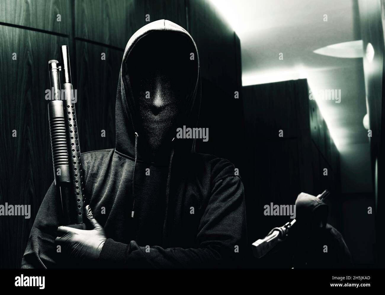 Group of criminal men in a hidden mask with a shotgun robbery the house ...