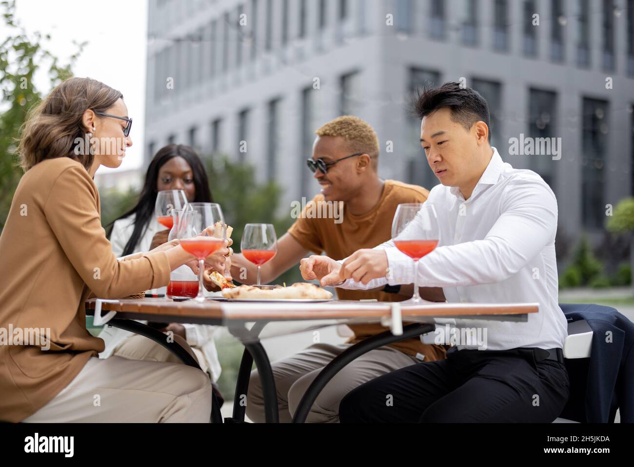 Business team having lunch at outdoor cafe Stock Photo - Alamy