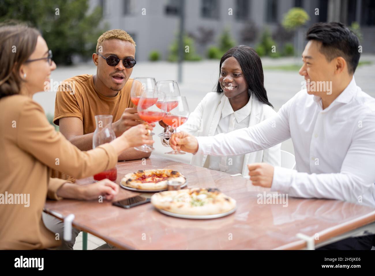 Joyful colleagues having lunch hi-res stock photography and images - Alamy