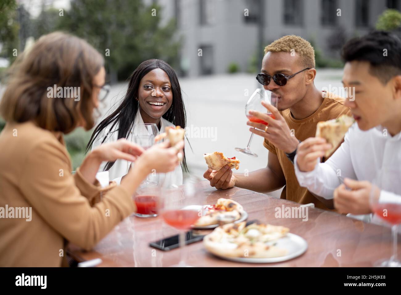 Business team having lunch at outdoor cafe Stock Photo - Alamy