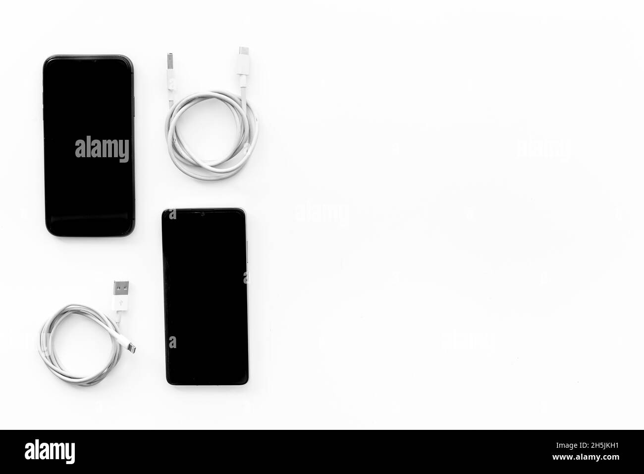 Cables for charging smartphone or laptop, top view Stock Photo - Alamy