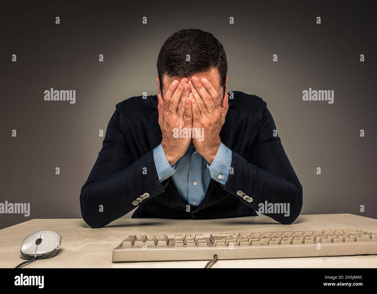Portrait frustrated young man covering face with hands while Stock ...