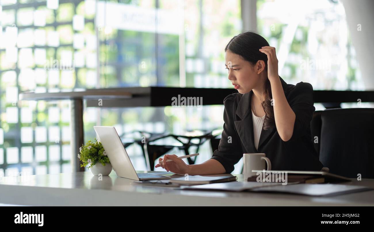 asian business woman thinking solving problem at work, worried serious ... asian business woman thinking solving problem at work, worried serious ...