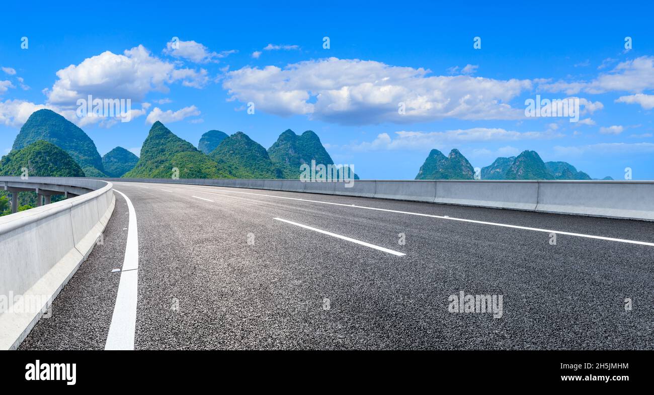 Empty asphalt highway and green mountain natural scenery in Guilin,China Stock Photo - Alamy