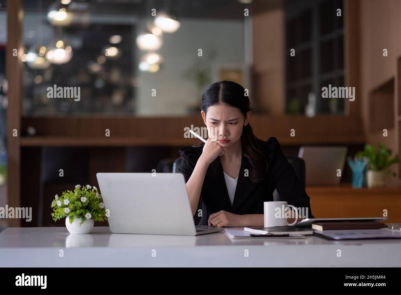asian business woman thinking solving problem at work, worried serious ... asian business woman thinking solving problem at work, worried serious ...