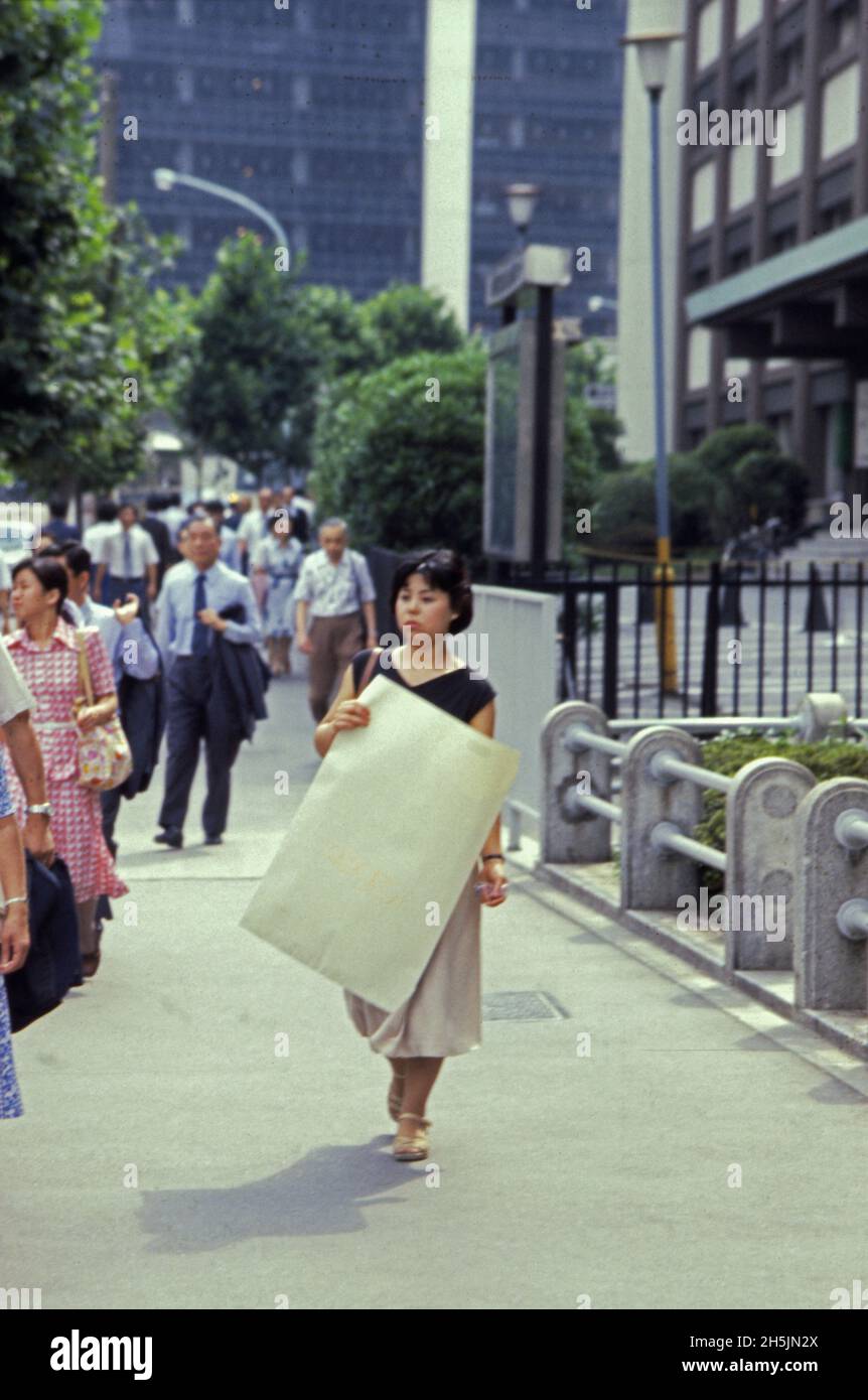 .A girl walks down the street, Japan, 1970s Stock Photo - Alamy