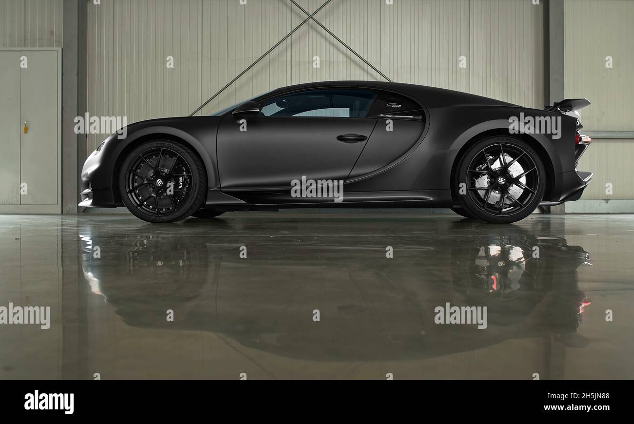 MUNICH, GERMANY - Oct 13, 2021: A side view of matte black Bugatti ...