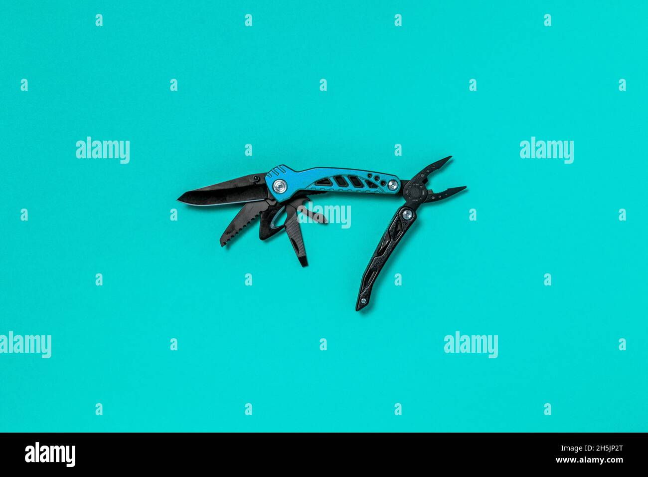 Steel multi tool on the blue flat lay background Stock Photo - Alamy