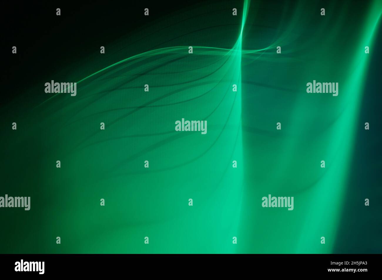 Incredible reflected green neon light layers on black background Stock Photo - Alamy