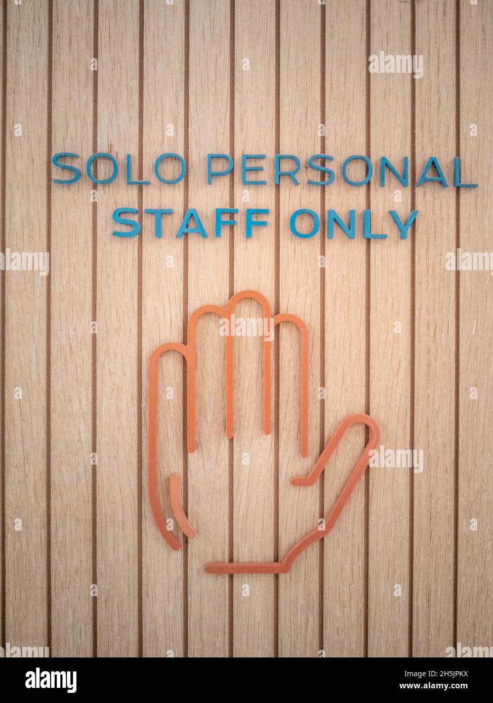 Sign indicating entry allowed only to staff working on the premises ...