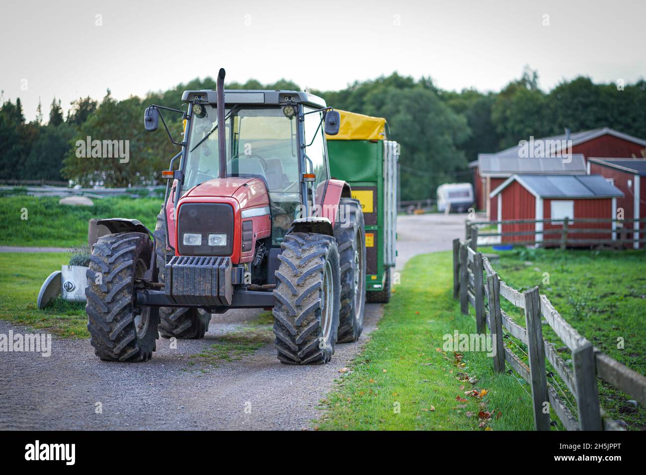 Tractor with a cattle trailer at the farm Stock Photo - Alamy