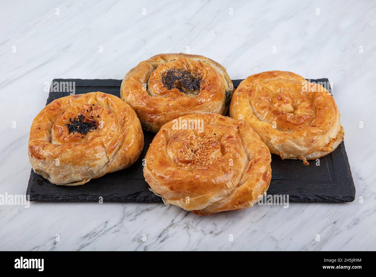Homemade turkish acma with nigella seeds. Freshly backed swirl buns ...