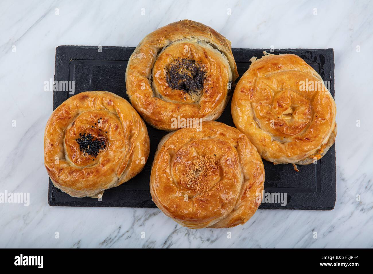 Homemade turkish acma with nigella seeds. Freshly backed swirl buns ...