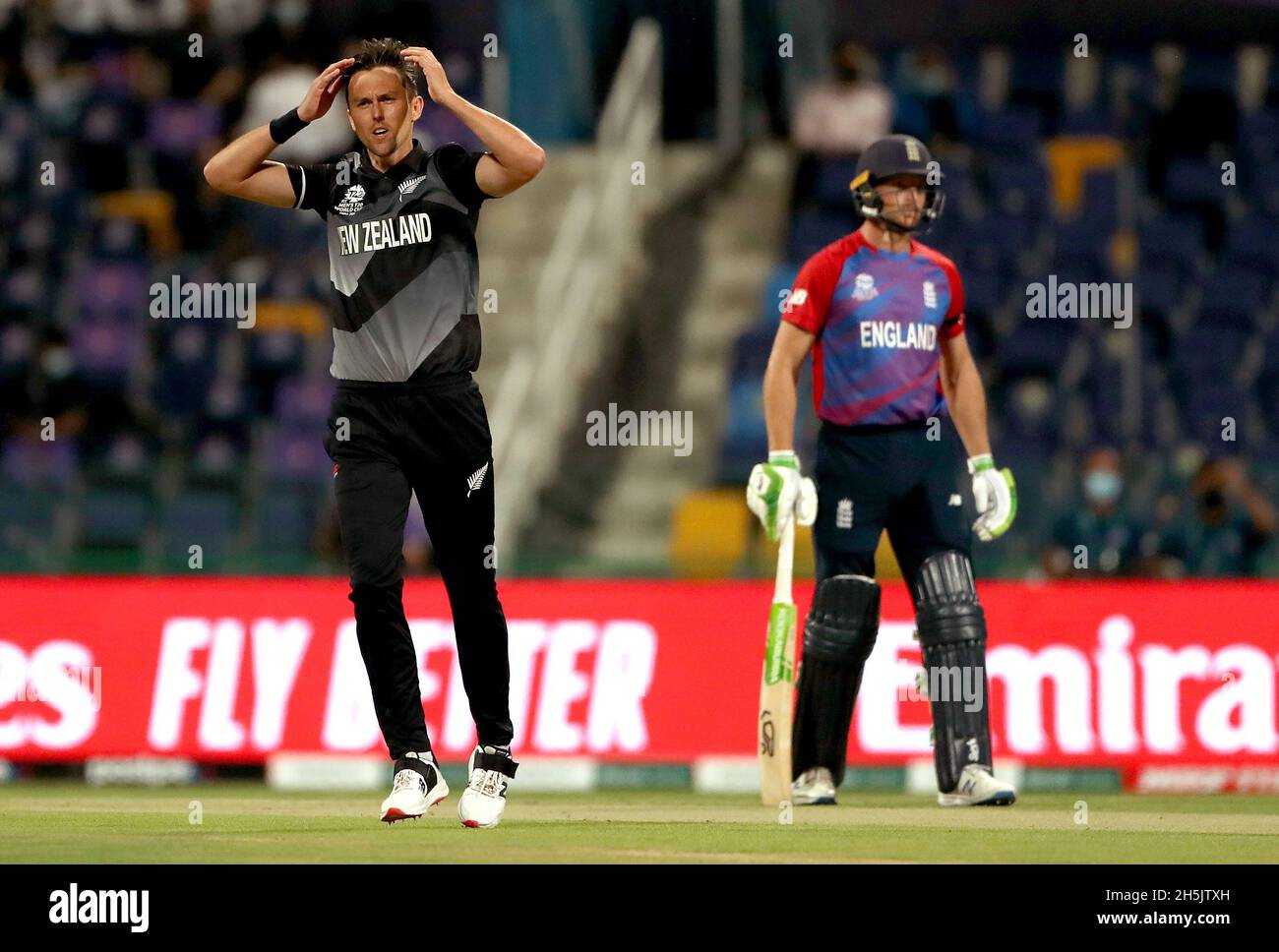 New Zealand's Trent Boult (left) and England's Jos Buttler during of ...