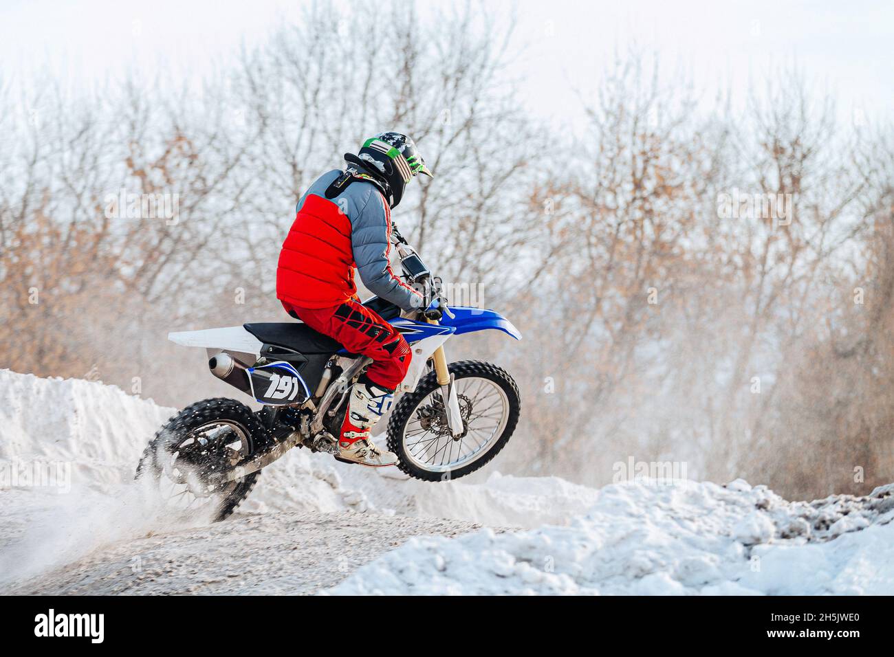 winter motocross racer riding a sports motorcycle Stock Photo - Alamy