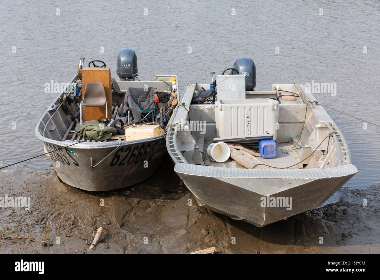 Two Yukon River fishing boats rest on the beach in Mountain Village ...