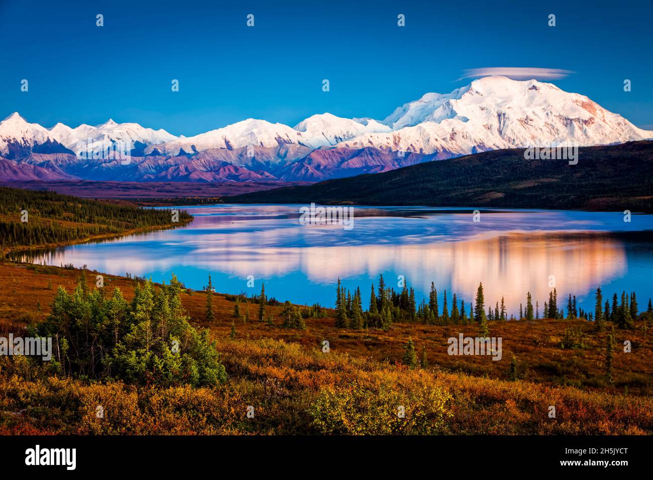 Sunset glow on Mount Denali (McKinley) reflects on Wonder Lake with ...