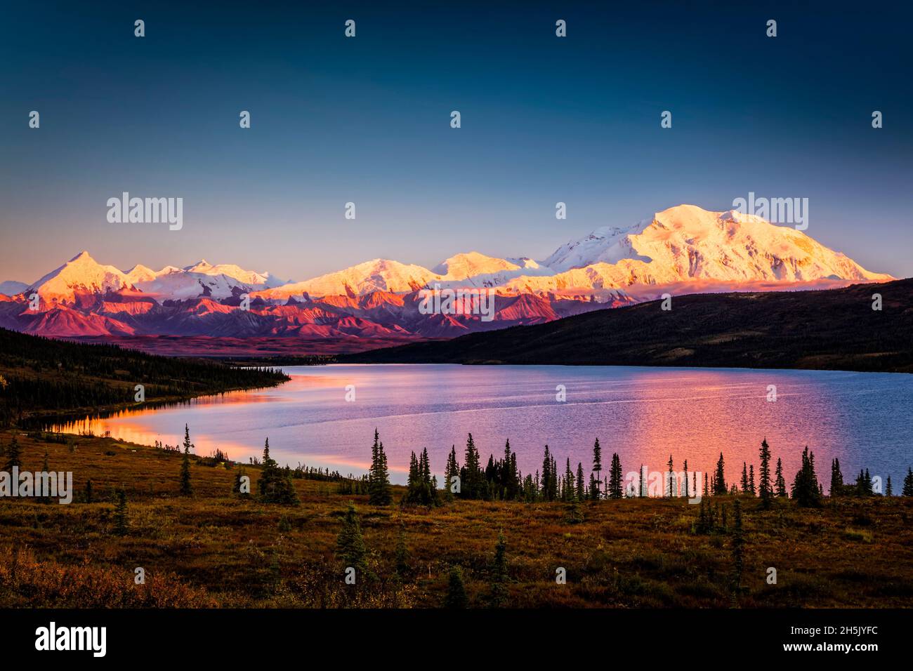 Sunset glow on Mount Denali (McKinley) reflects on Wonder Lake with ...