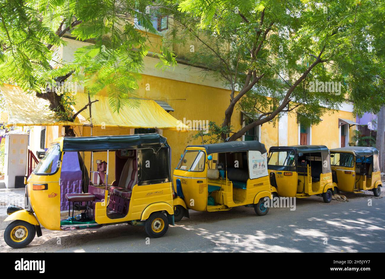 Auto rickshaws parked along a street in Puducherry, India; Puducherry ...