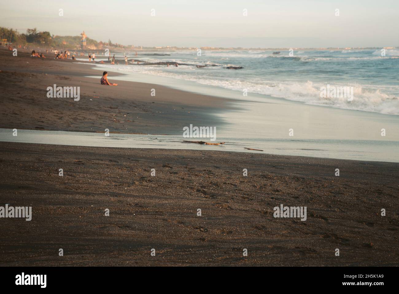 Sunbathers enjoying Munggu Beach in Bali; Munggu, Bali, Indonesia Stock ...