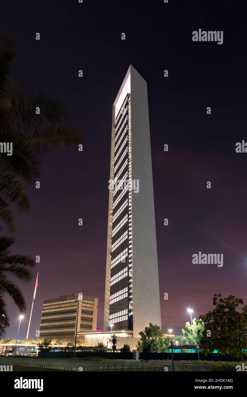 ADNOC Headquarters building, a skyscraper at dusk; Abu Dhabi, United ...