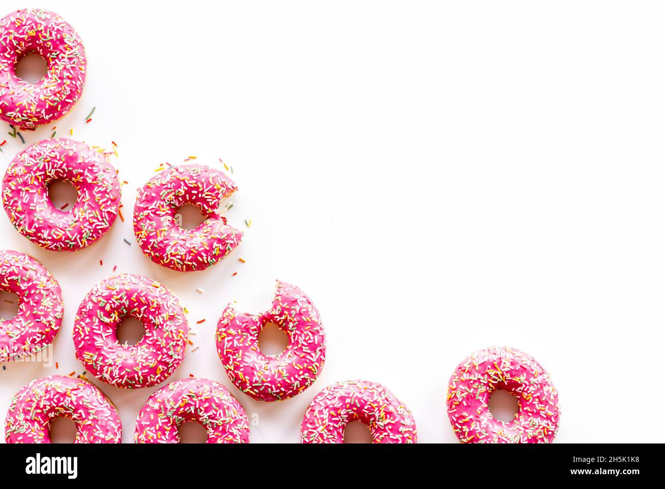 Pink glazed donutes background - set of donuts with icing Stock Photo ...