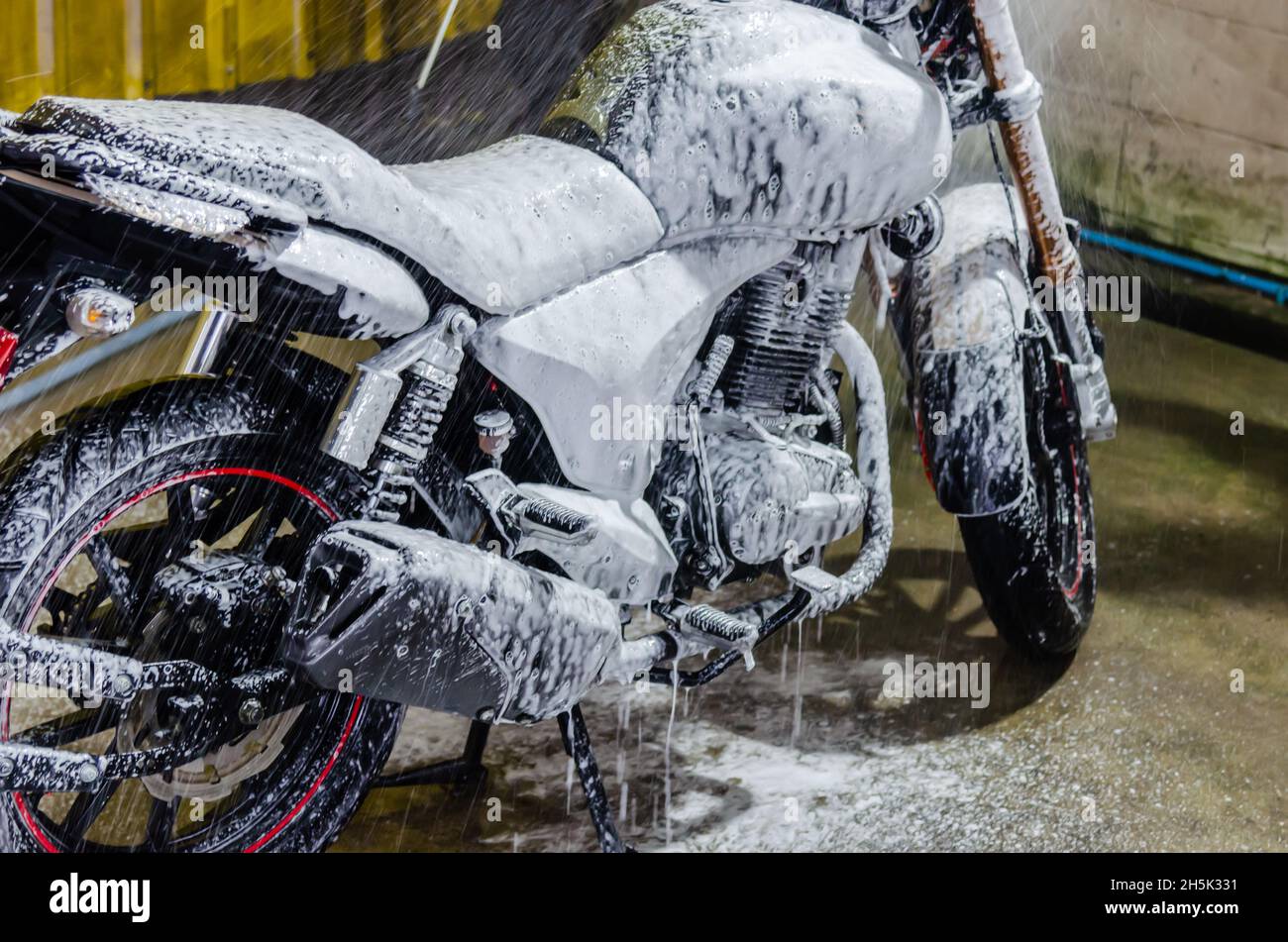 Motorcycle foam wash at the car wash shop cleaning Stock Photo - Alamy
