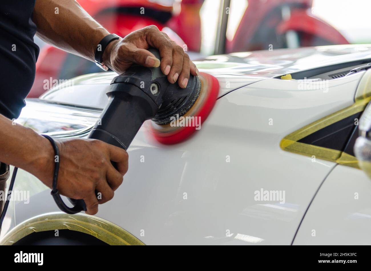 Man hands holding the work tool polish the car.Buffing and polishing ...