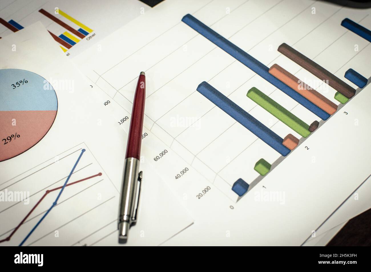 financial charts and graphs on the table Stock Photo - Alamy
