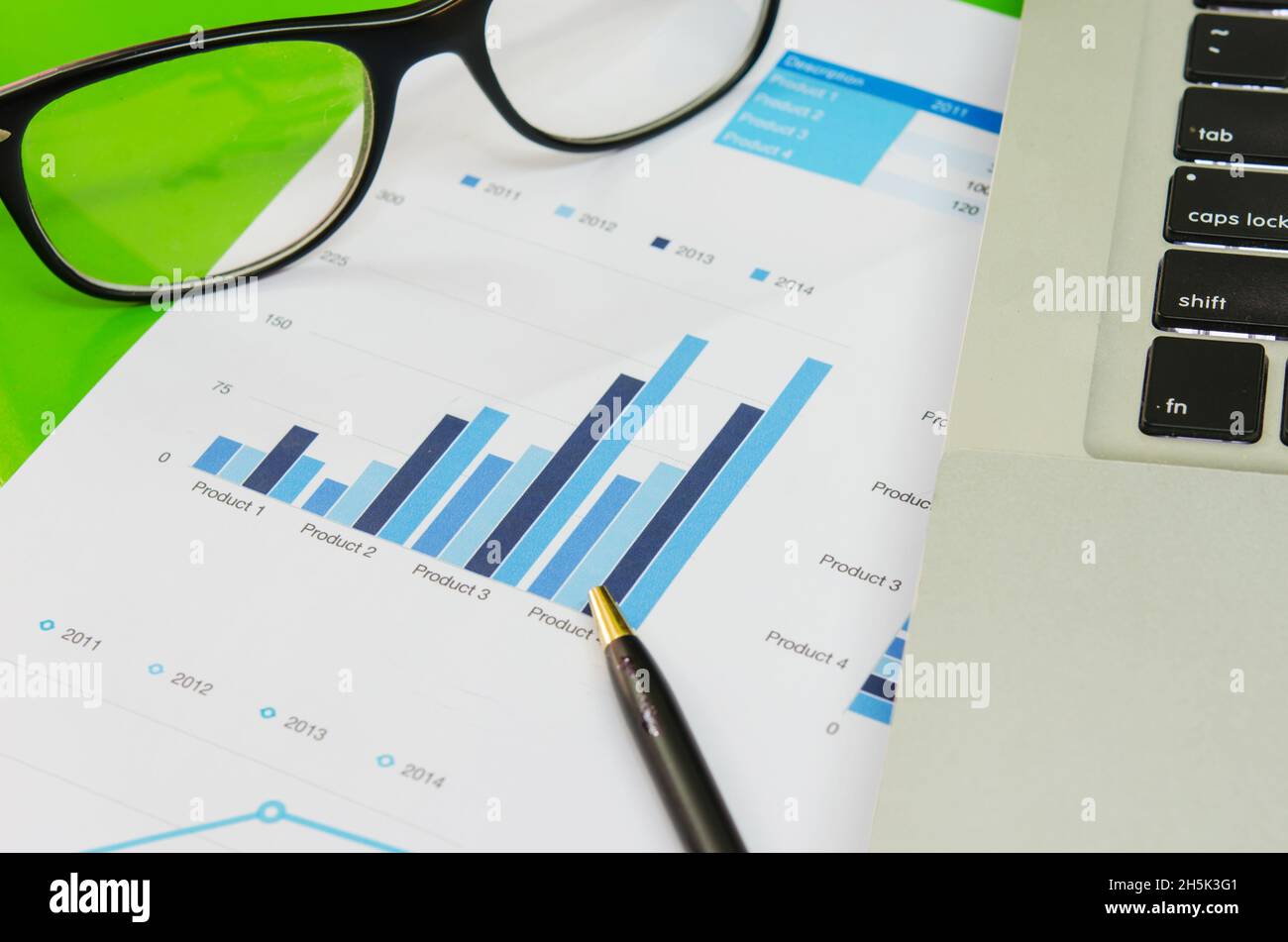 business workplace and computer and printed data sheet Stock Photo - Alamy