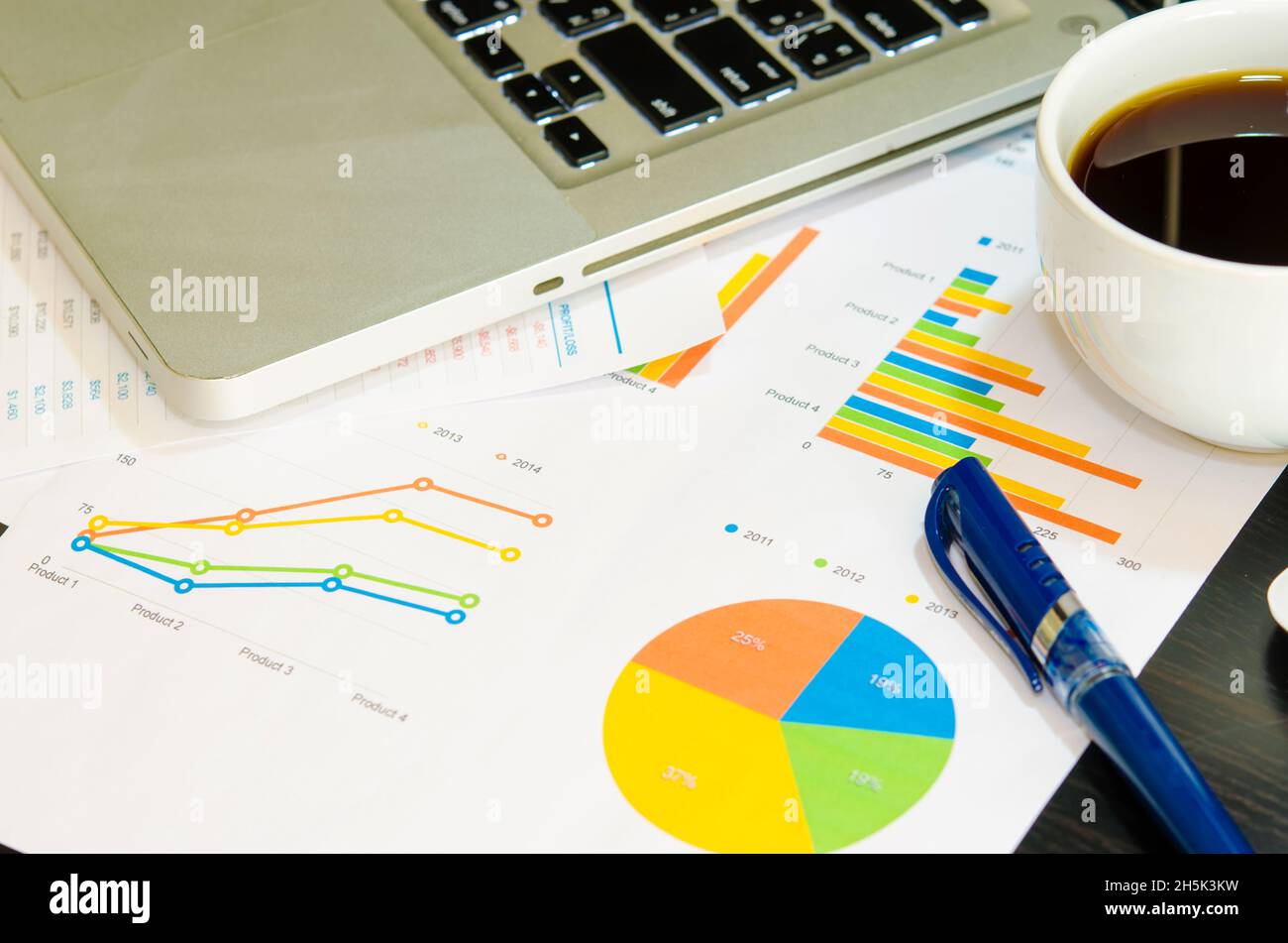 Business graphs and pen analysis report. Accounting Stock Photo - Alamy