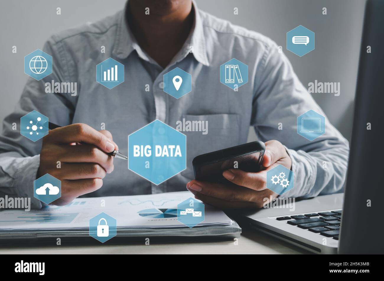 businessman holding pen and smartphone icon big data virtual screen ...