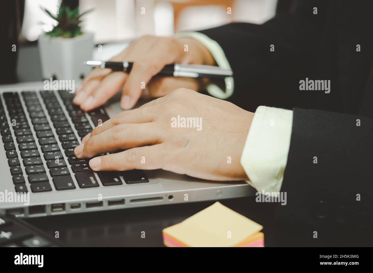 hand business man is typing on a computer keyboard Stock Photo - Alamy