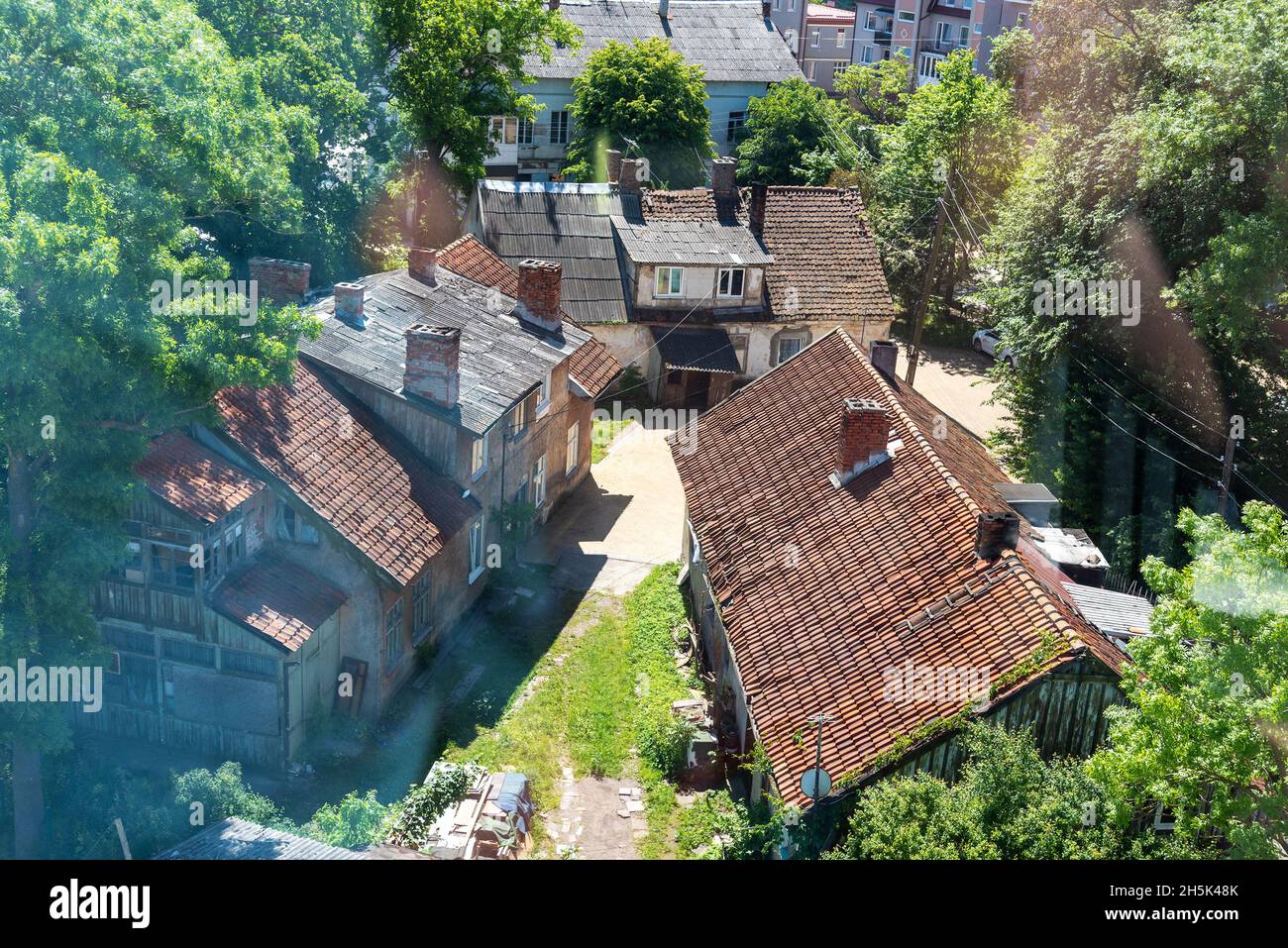 A bird's-eye view of the metal tile roof of the house from above. The ...