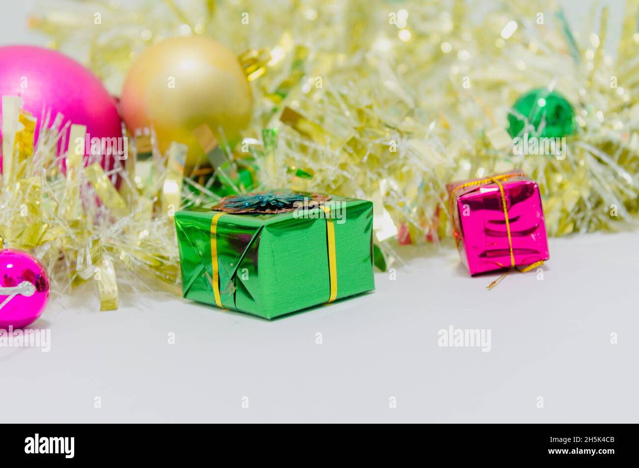 Gift box red and green on a white background Stock Photo - Alamy