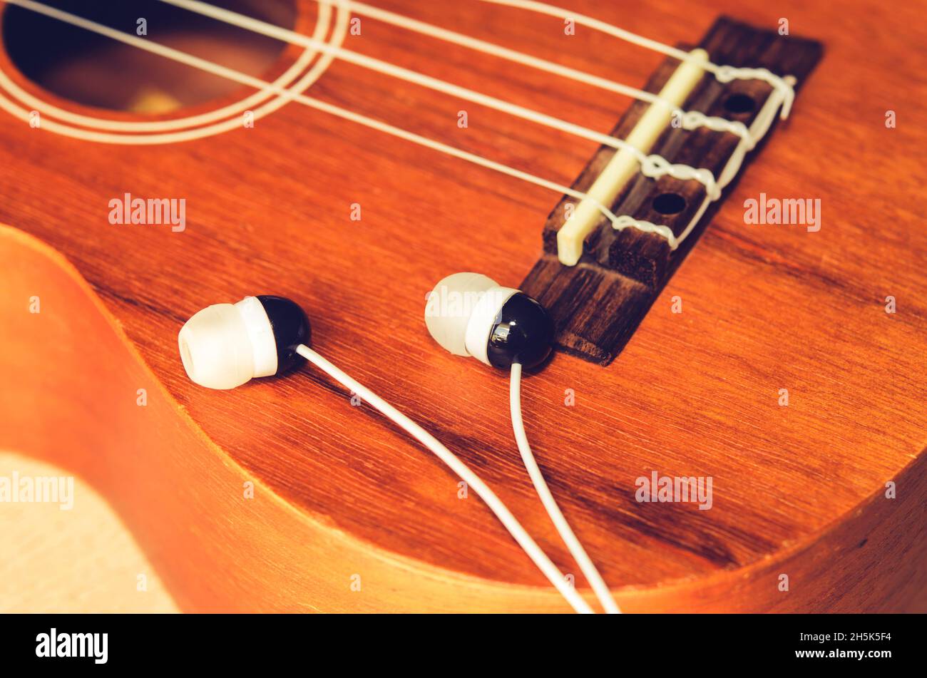 Vintage ukulele on wooden background Stock Photo - Alamy