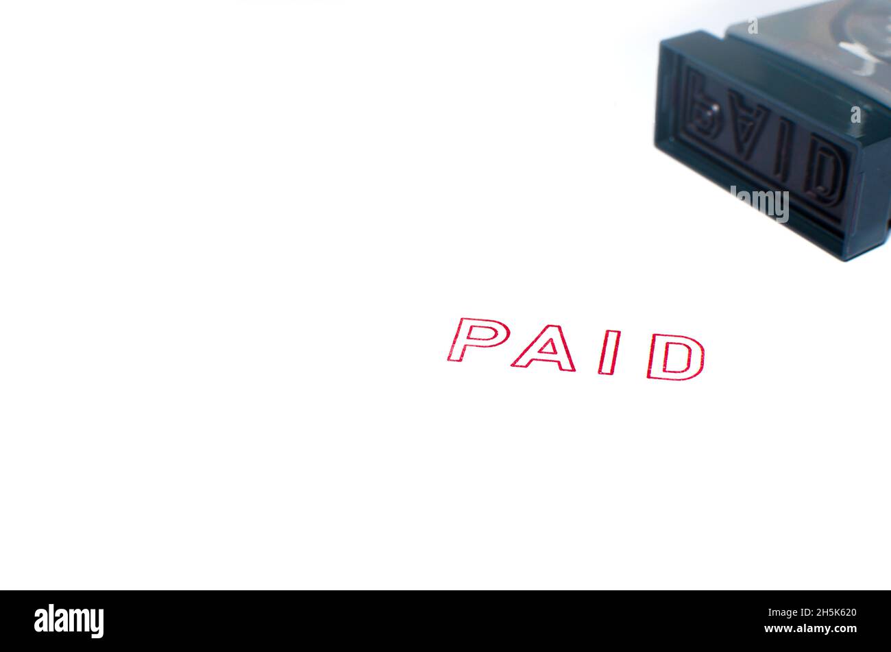 stamping of documents paid Stock Photo - Alamy