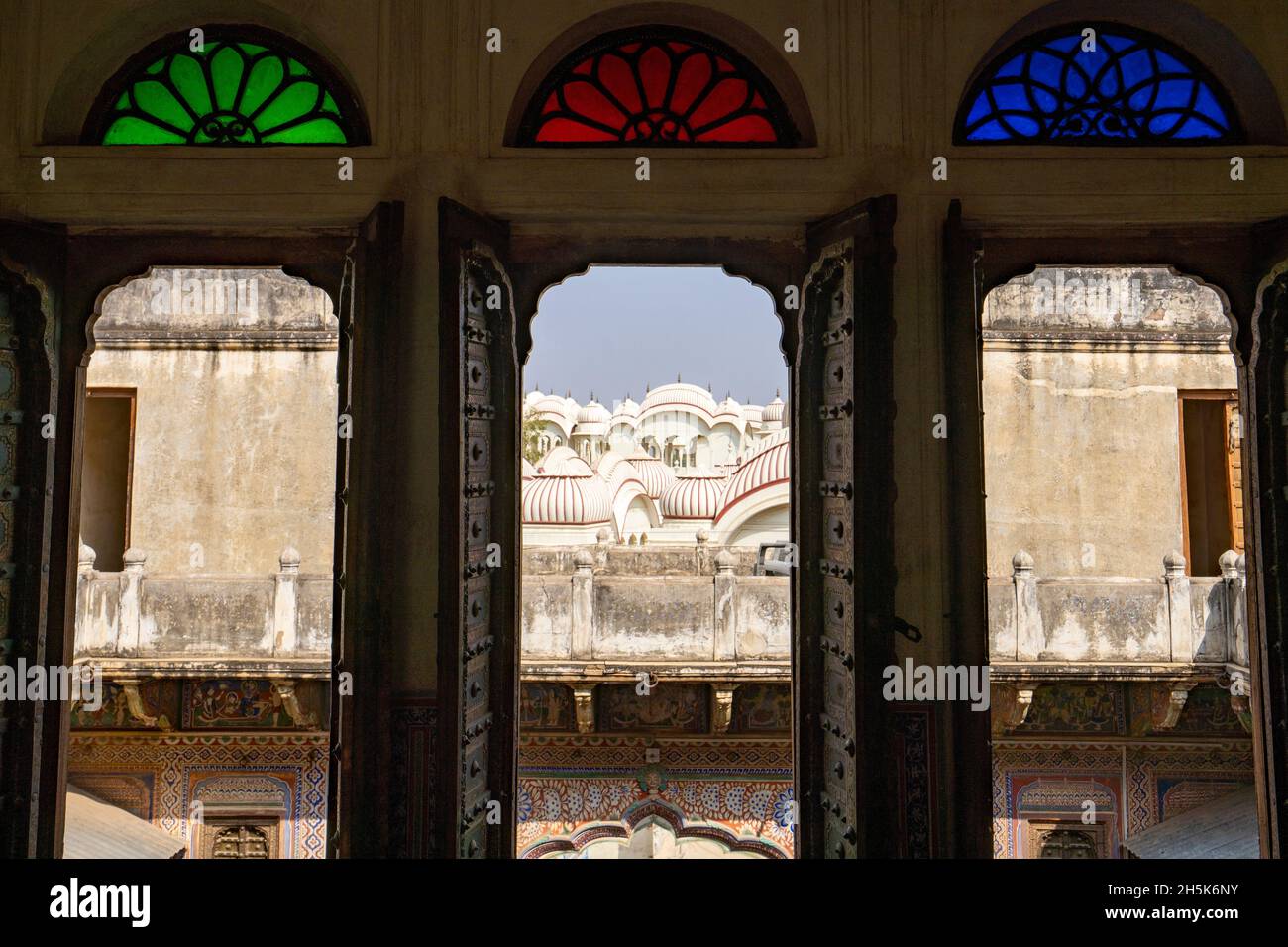 View through arched, painted Haveli windows; Nawalgarh, Shekawati ...