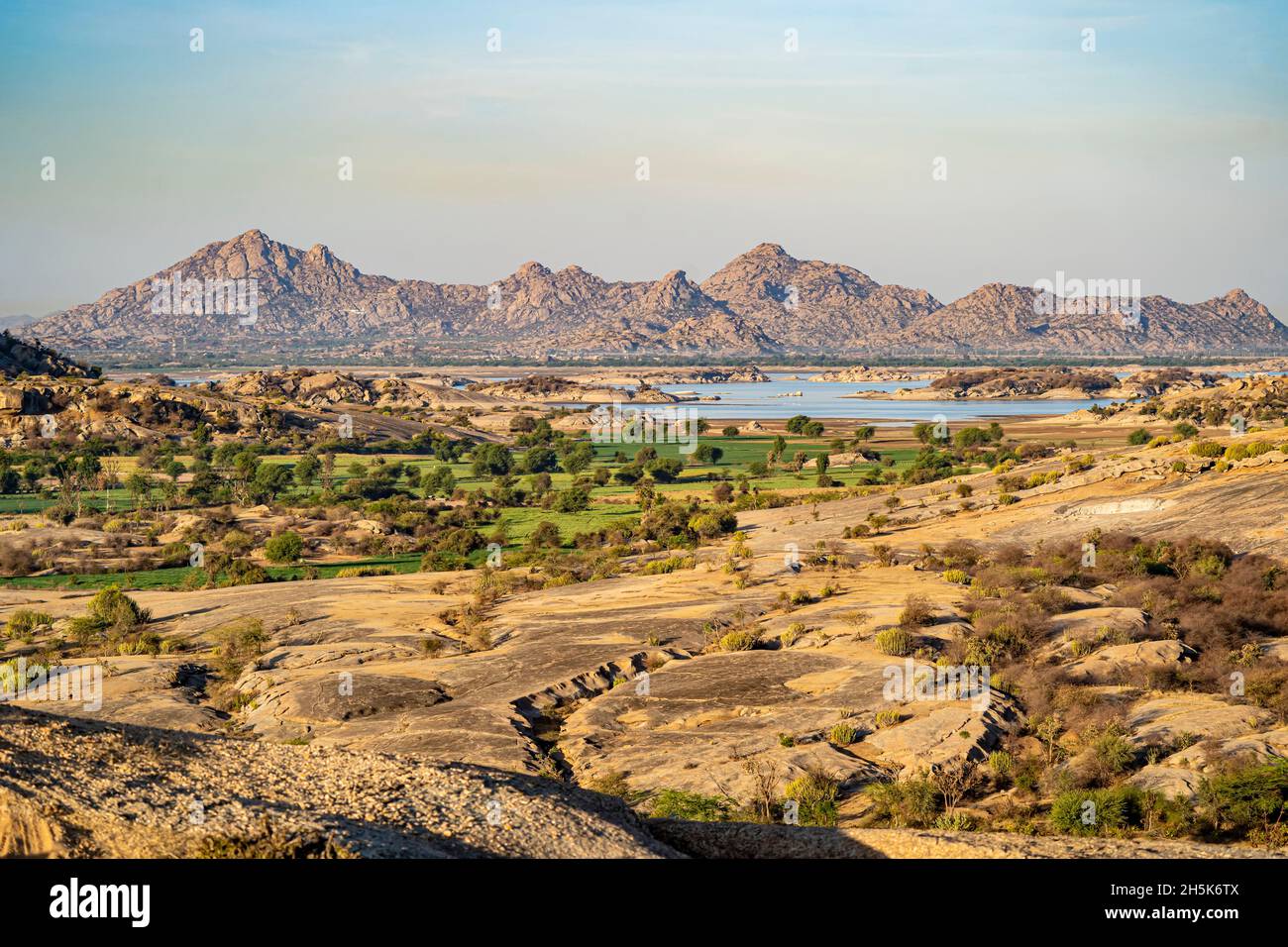 A dam lake and the changing landscape of the desert and the Aravali ...