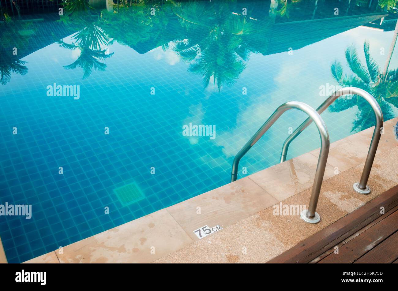 Outdoor swimming pool in hotel resort Stock Photo - Alamy
