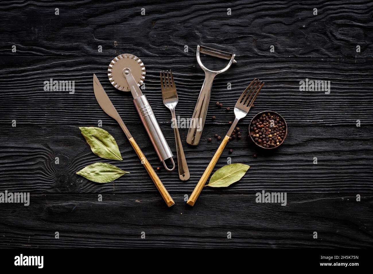 Flat lay of metal kitchen utensils and cookware Stock Photo - Alamy
