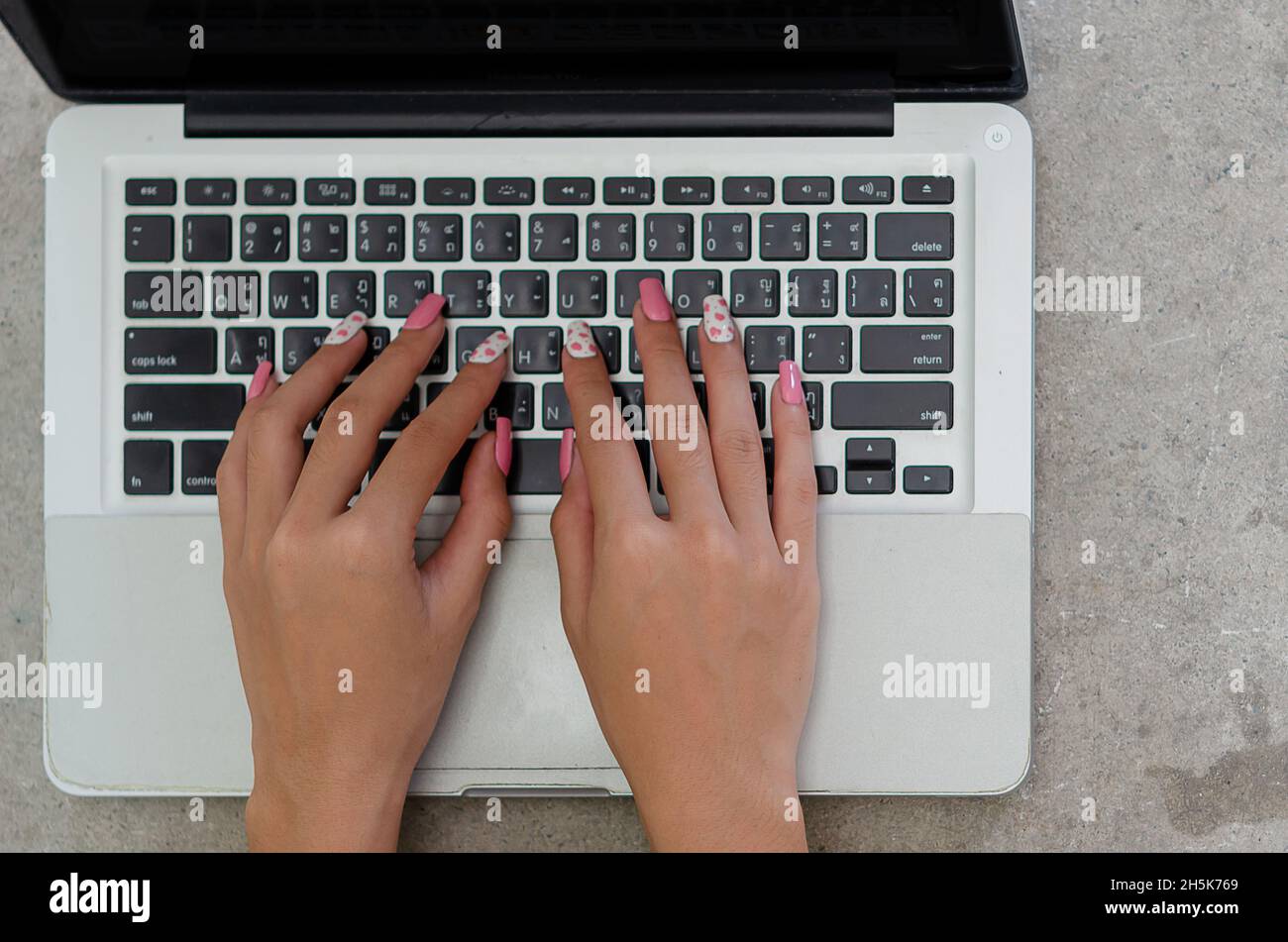 Top view hand woman using a laptop computer keyboard. concept ...
