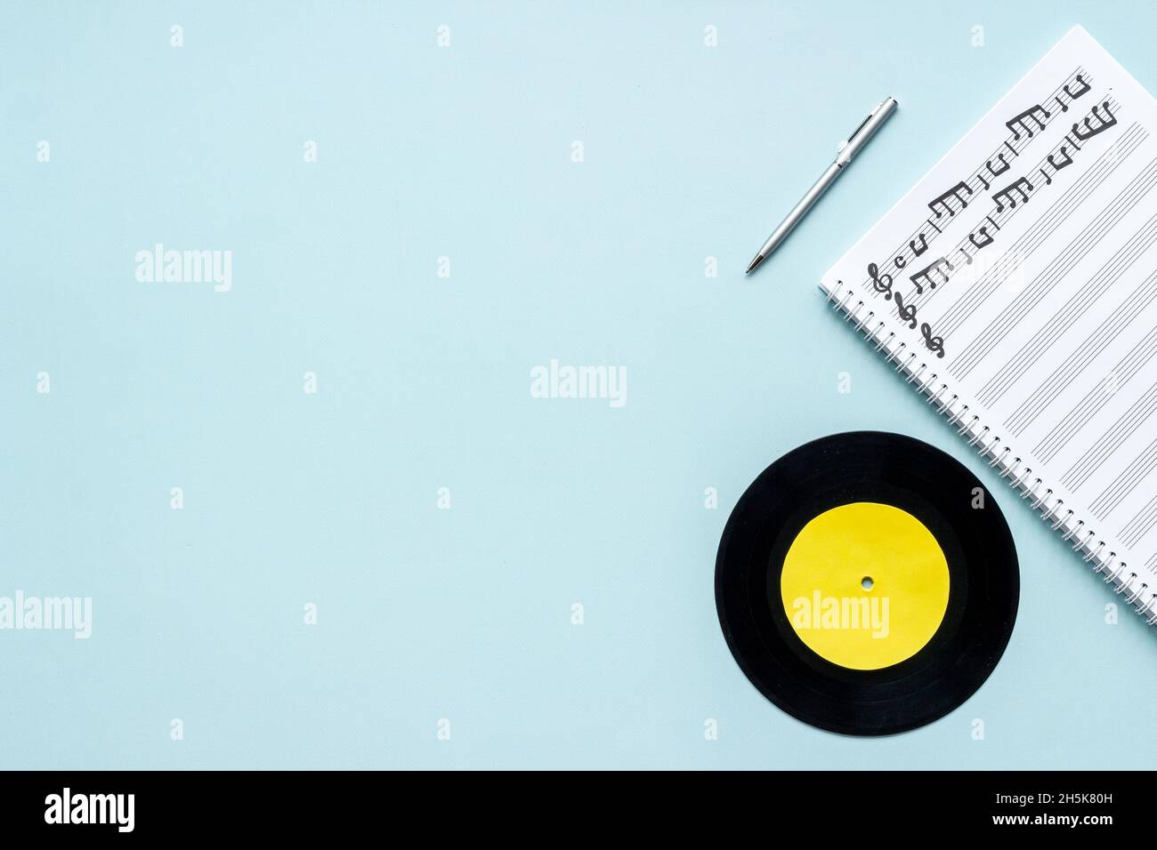 Sheets with music notes and vinyl record. Compose music concept Stock ...