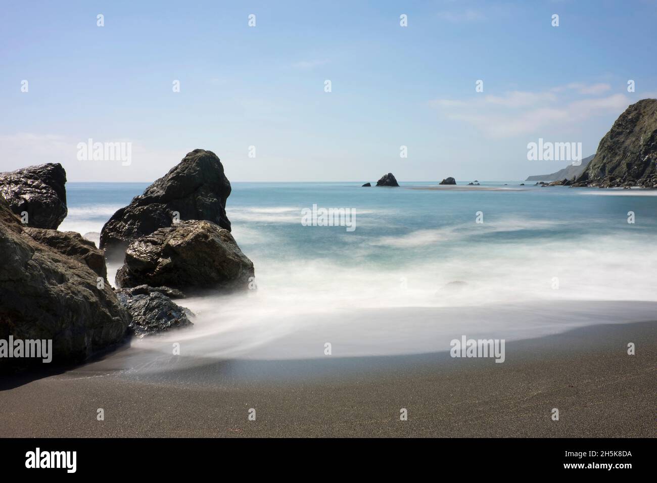 Rock formations along the beach in Big Sur on a sunny day; Big Sur ...